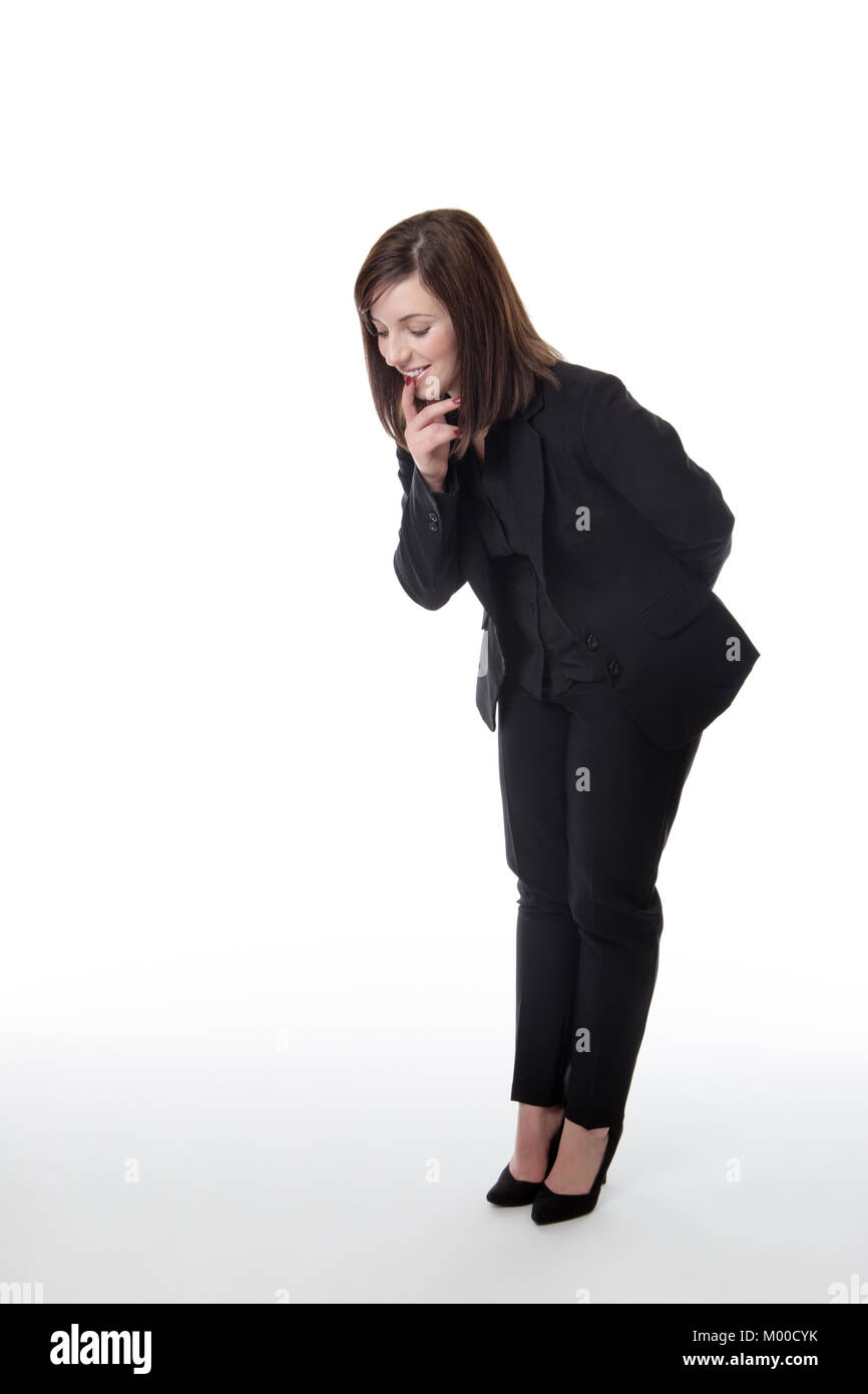 standing business woman looking down at something on the ground Stock ...