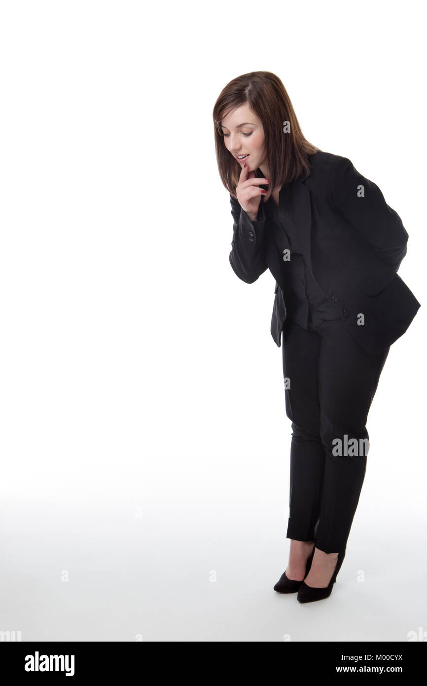 standing business woman looking down at something on the ground Stock ...