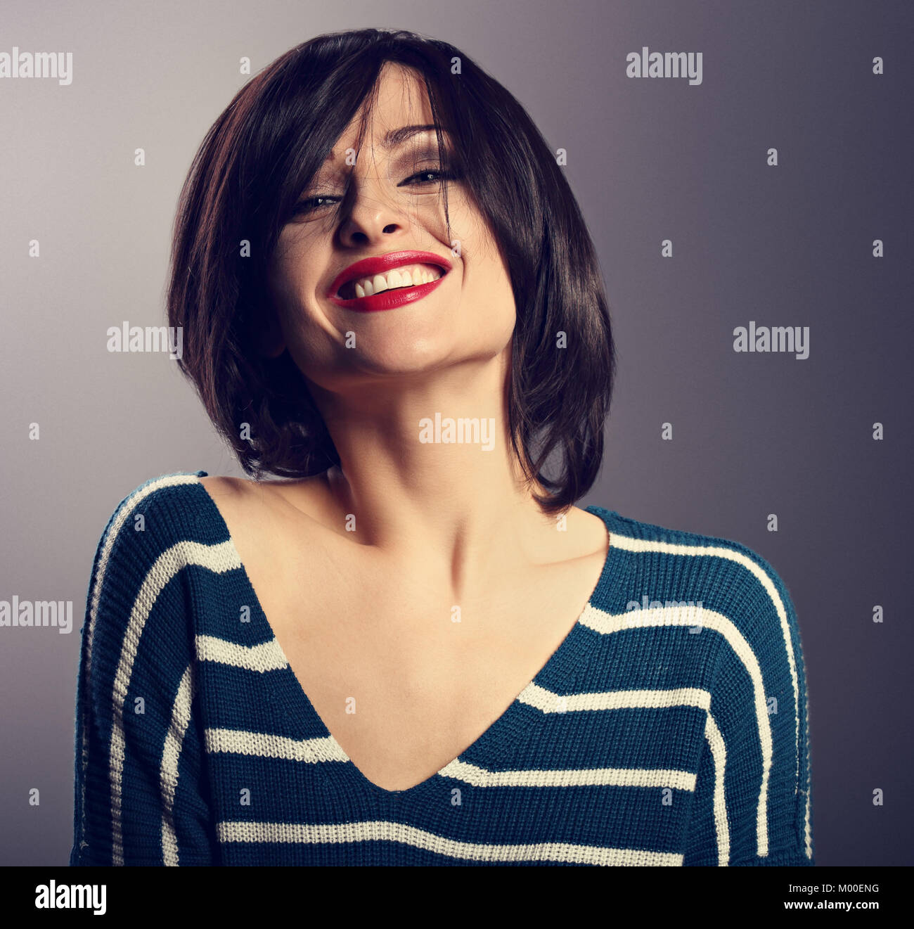 Happy loudly laughing with wide smile young woman with short hair in ...