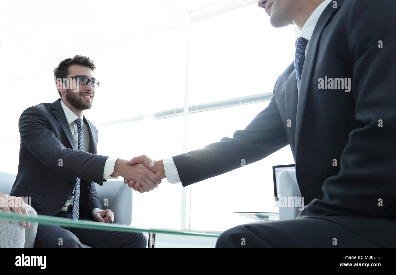 handshake business partners in the office Stock Photo - Alamy