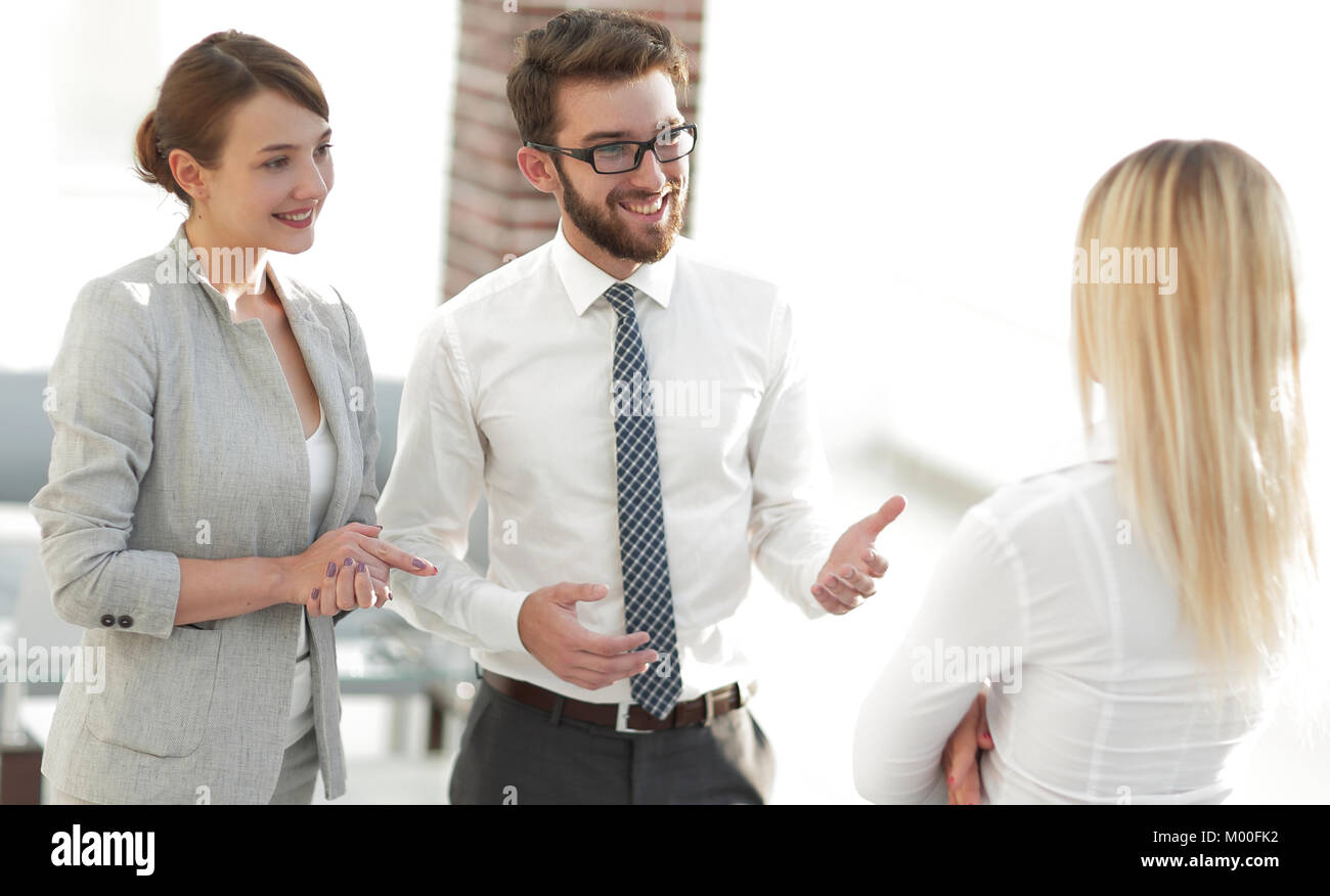 Manager and business team talking in the office Stock Photo - Alamy