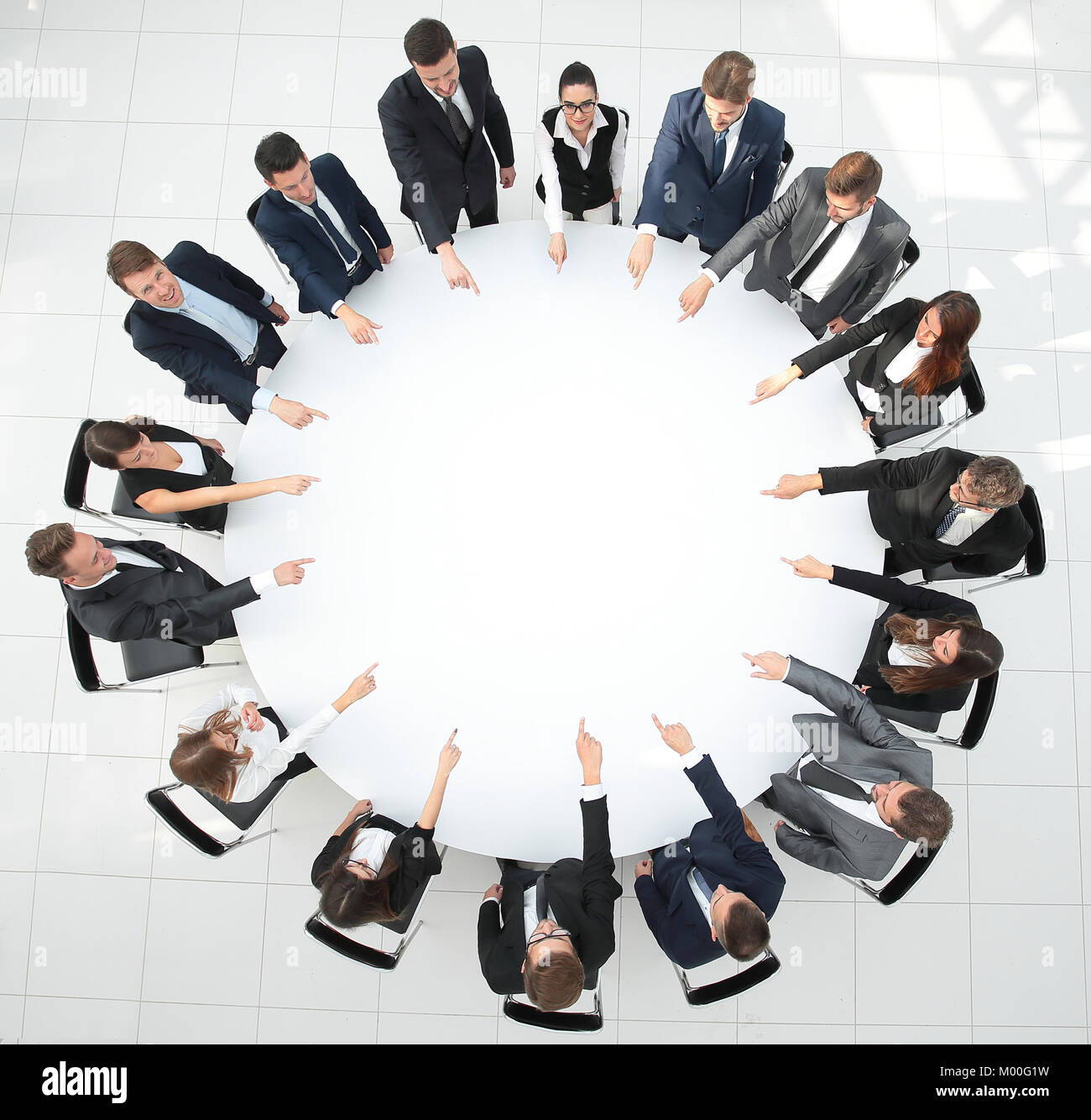 closeup .business team pointing in the center of the table Stock Photo ...