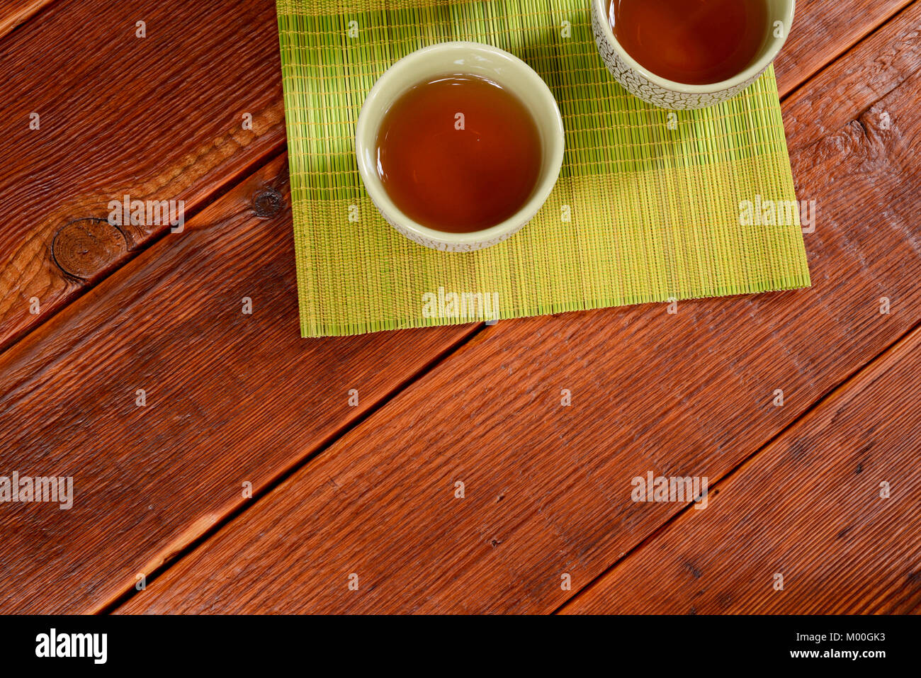 Still life of traditional Chinese crackle glaze tea cups filled with ...