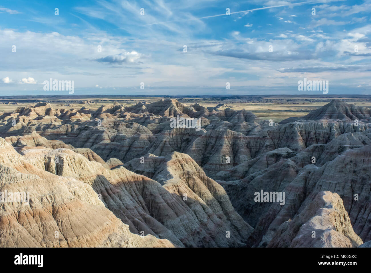 The tan of the sandstone ridges are a sharp contrast with the bright ...