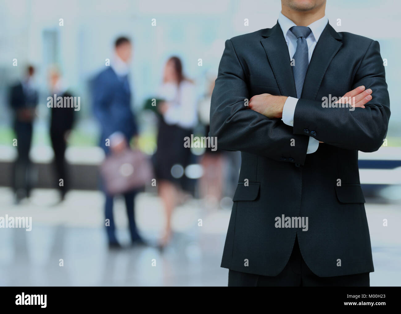 business man standing in an office Stock Photo - Alamy