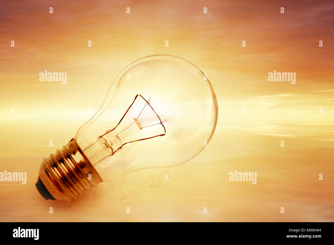 Light bulb on bright background Stock Photo - Alamy