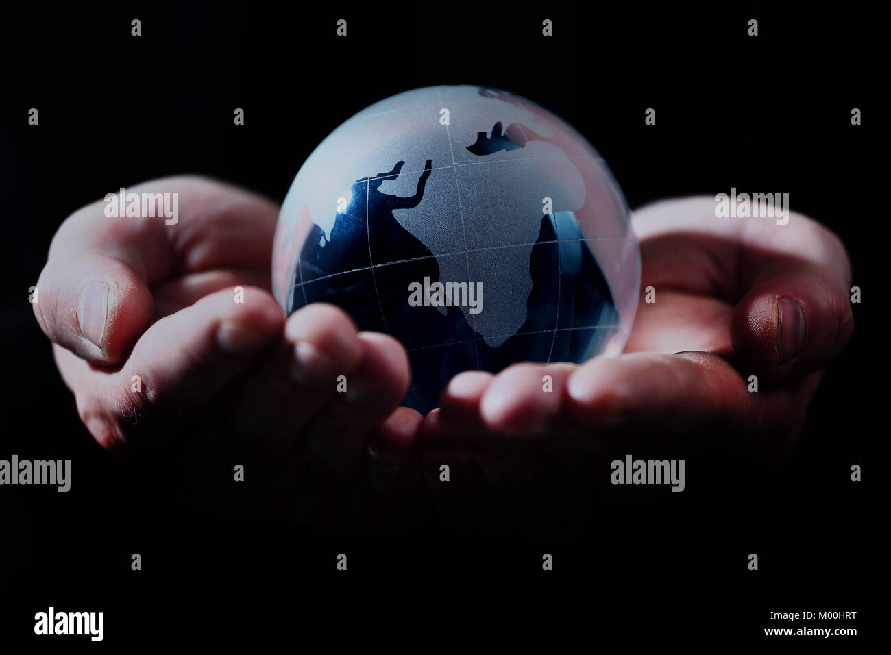 glass globe in hand Stock Photo - Alamy