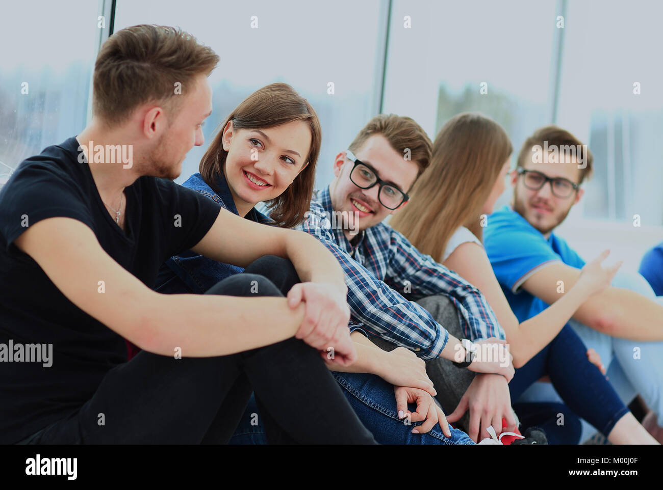 student group chatting indoors Stock Photo - Alamy