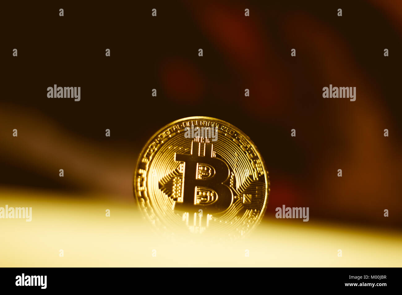 Cryptocurrency of physical gold bitcoin coin on red background Stock ...
