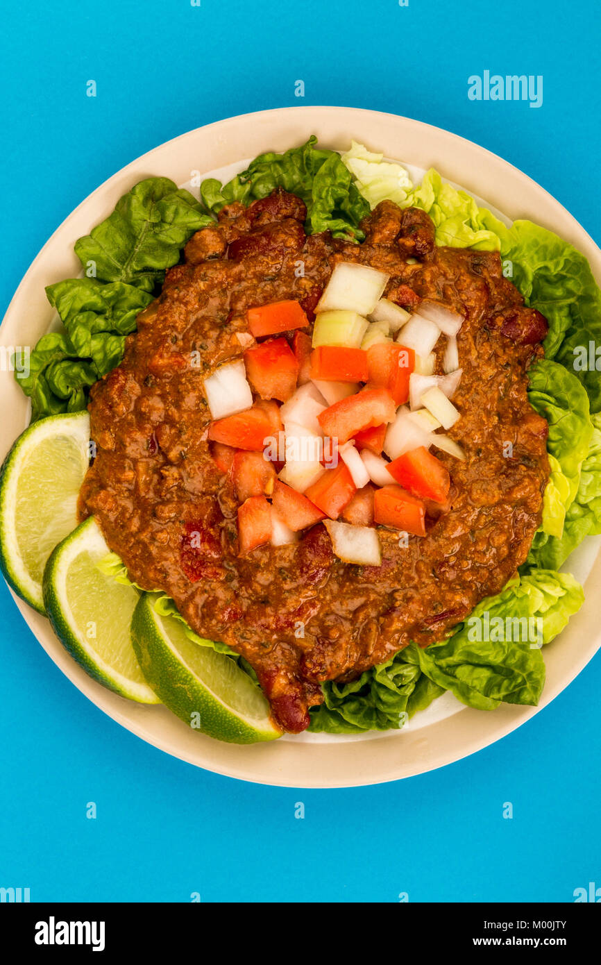 Spicy Mexican Style Beef Taco Meat and Salad With Fresh Limes Against A ...