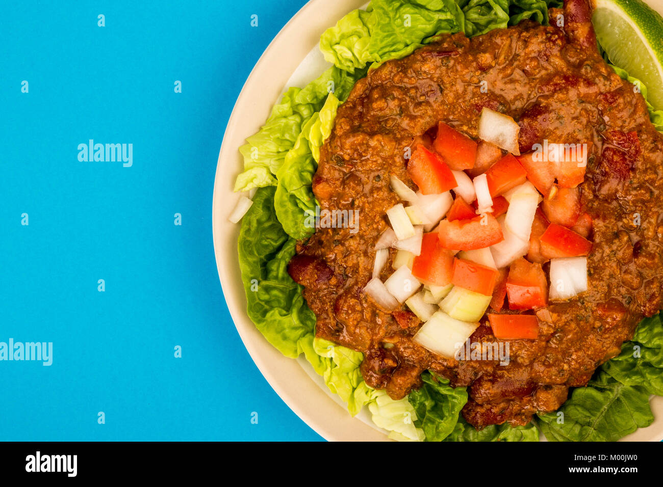 Spicy Mexican Style Beef Taco Meat and Salad With Fresh Limes Against A ...