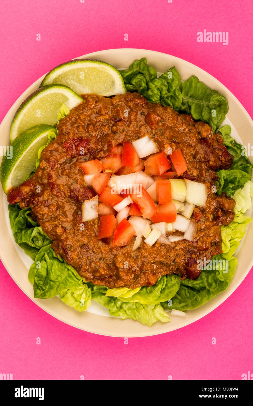 Spicy Mexican Style Beef Taco Meat and Salad With Fresh Limes Against A ...