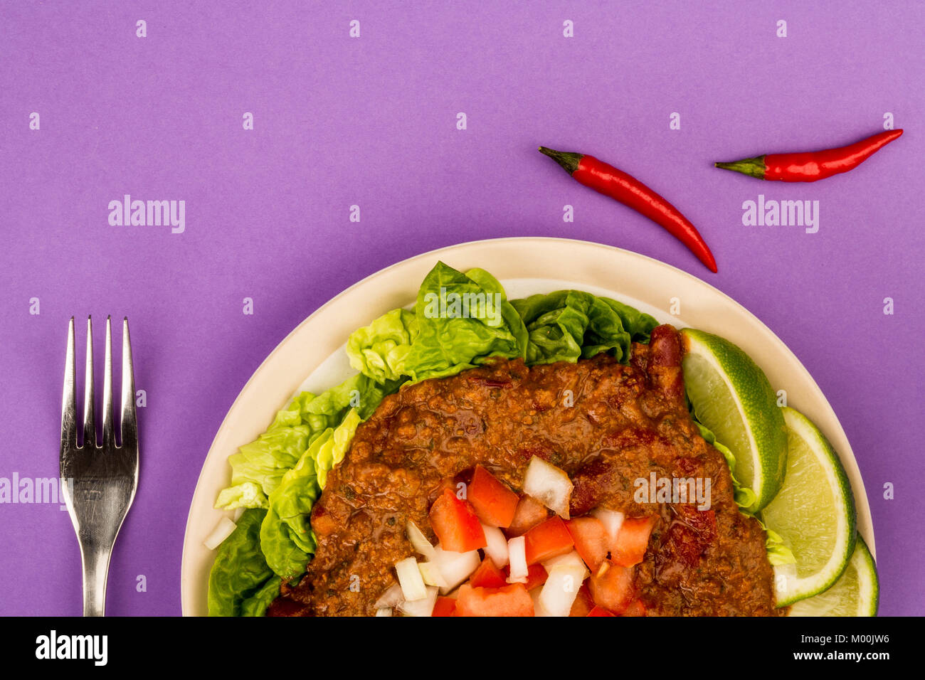 Spicy Mexican Style Beef Taco Meat and Salad With Fresh Limes Against A ...