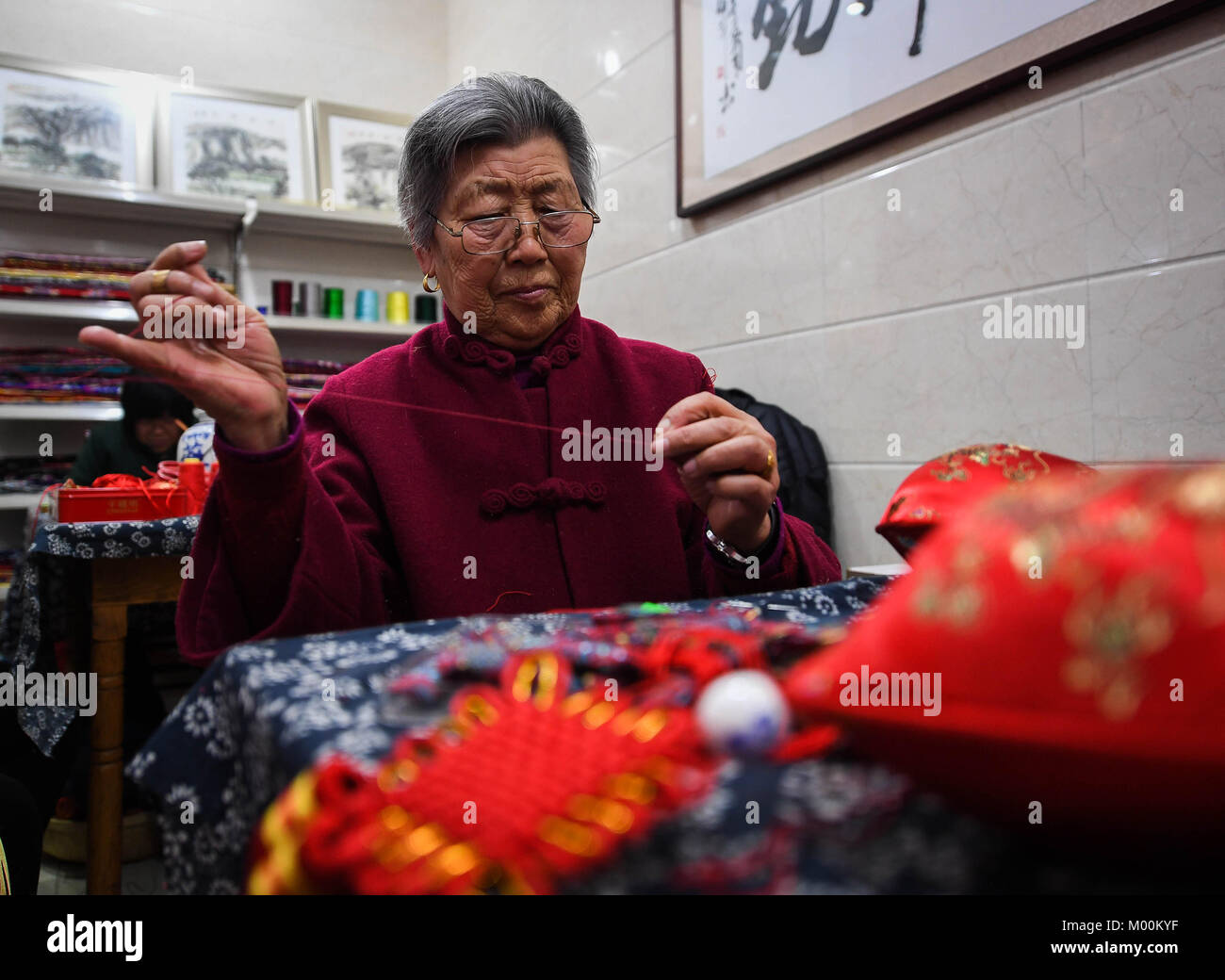 (180117) -- XUZHOU, Jan. 17, 2018 (Xinhua) -- Wang Xiuying makes a ...