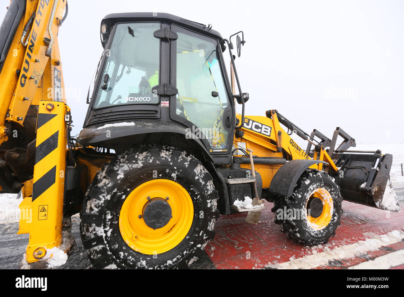 Calderdale, West Yorkshire. 17th Jan, 2018. A JCB been used to clear ...