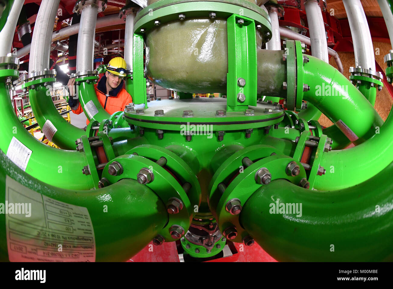 Chemical technician Andy Becker checks the flotation cells of a so ...