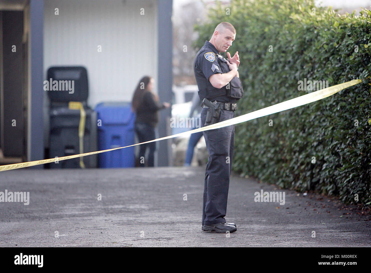 Napa, CA, USA. 17th Jan, 2018. A Napa police officer secures the scene ...