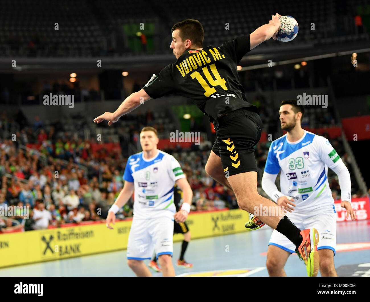 Zagreb, Croatia. 17th Jan, 2018. Montenegro's Milos Vujovic (C) throws ...