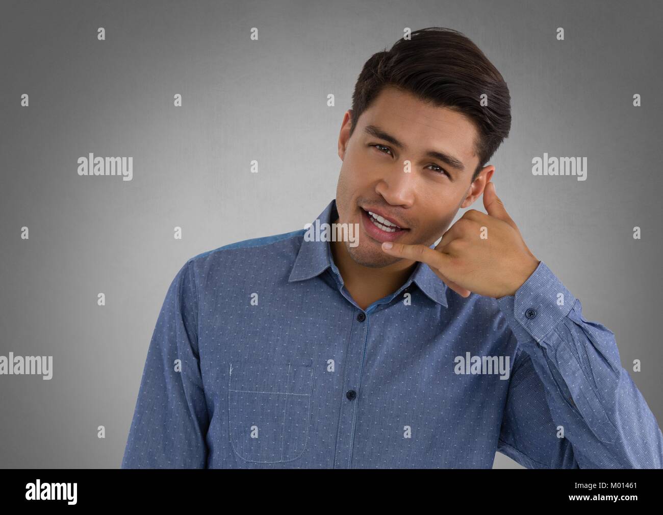 man smiling with ring me sign Stock Photo - Alamy