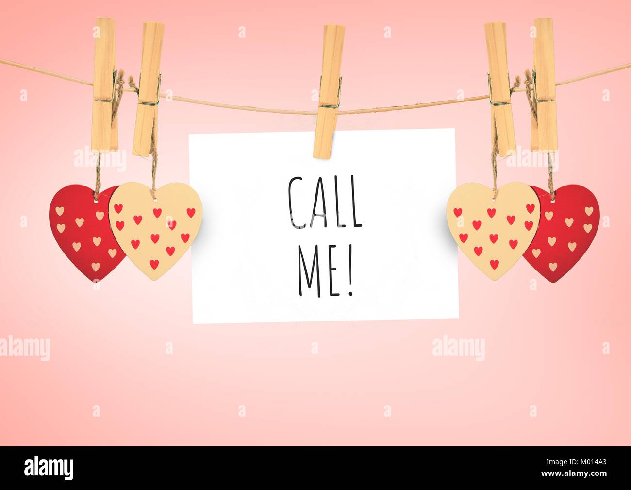 call me text on post it on wash line Stock Photo - Alamy