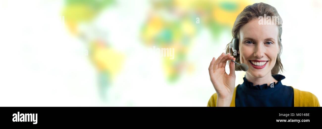 Travel agent woman wearing headset in front of world map Stock Photo ...