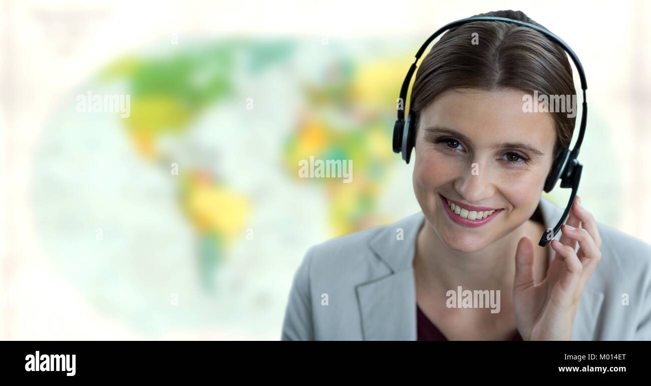 Travel agent woman wearing headset in front of world map Stock Photo ...