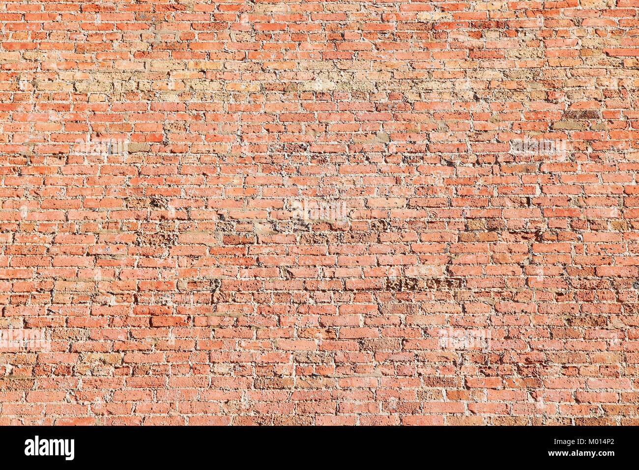 Red aged brick wall texture. Building background Stock Photo - Alamy