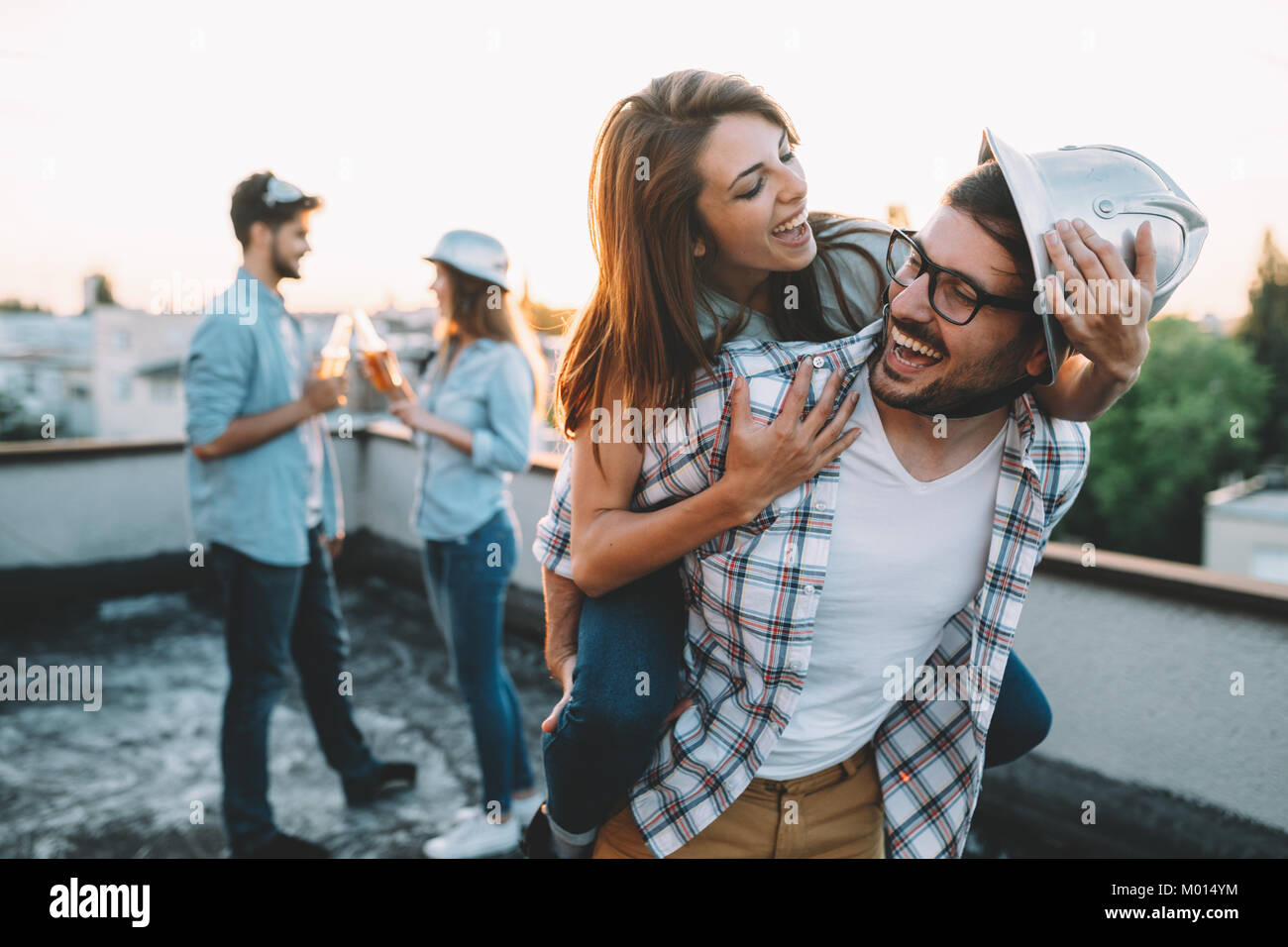 Happy cheerful friends spending fun times together Stock Photo - Alamy