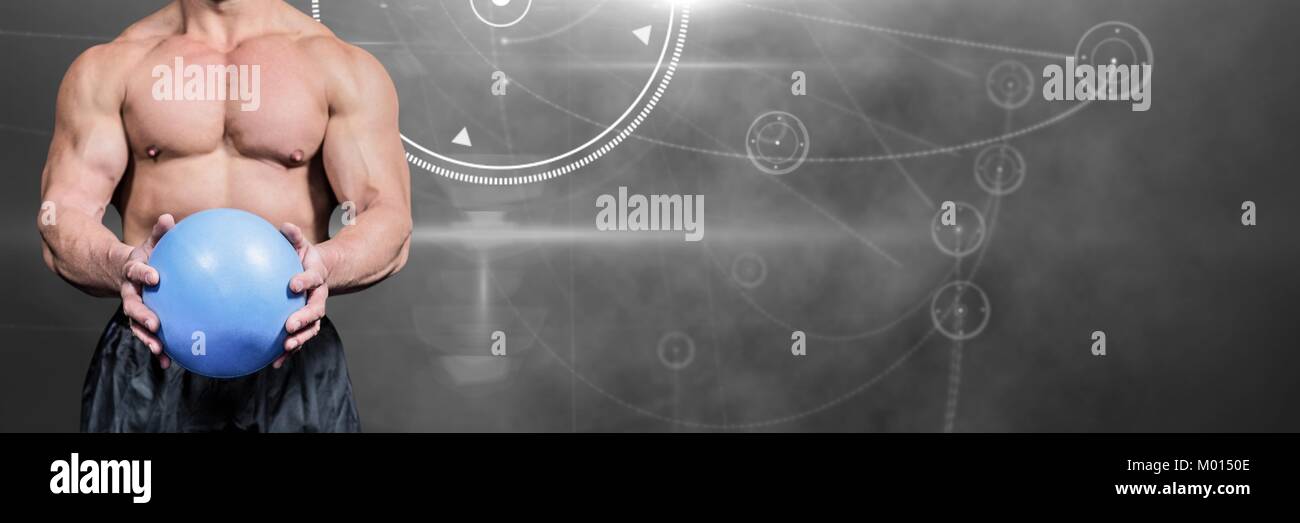 Athletic fit strong man holding ball with connections in background ...