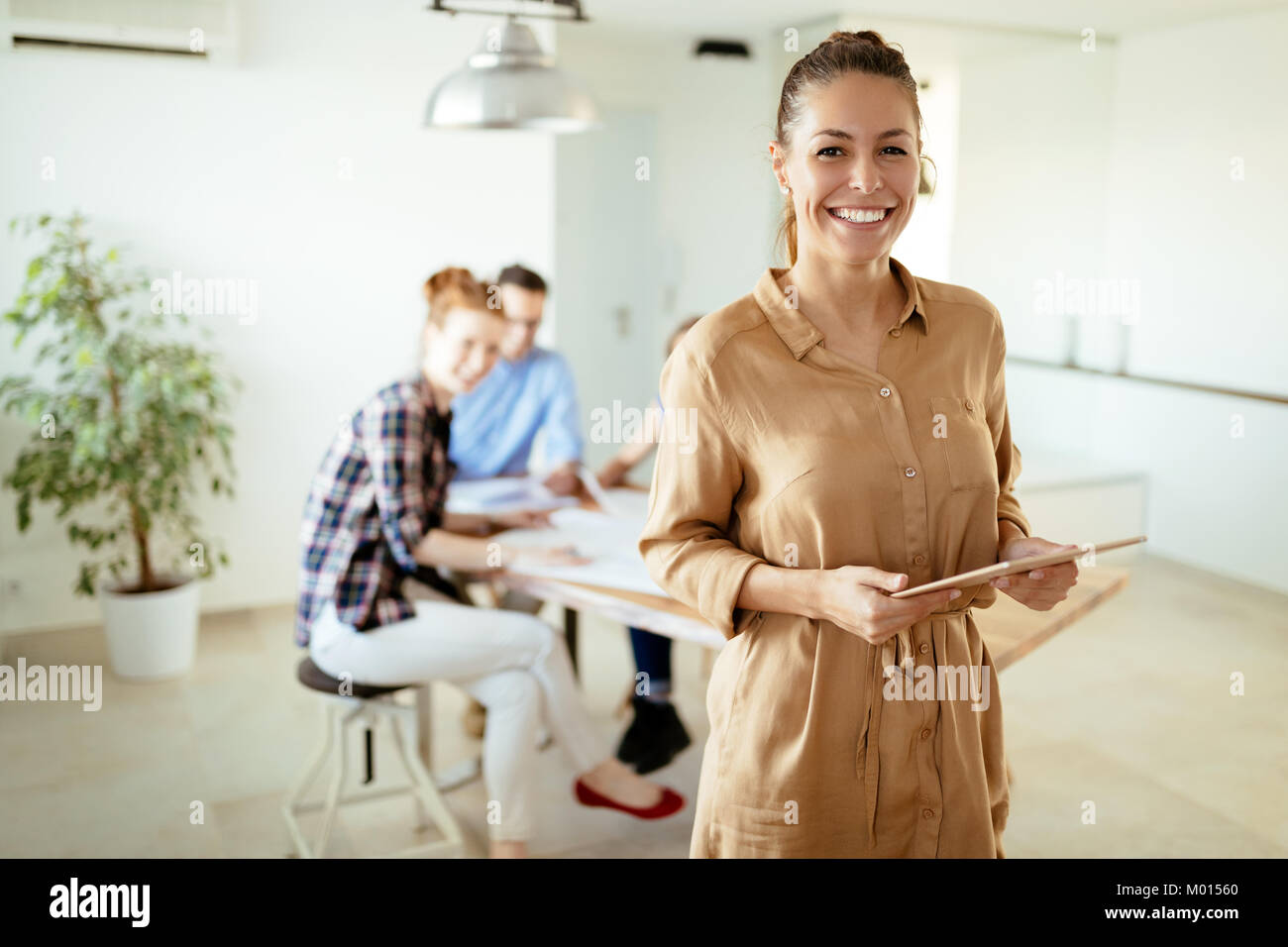 Image of business woman looking at tablet Stock Photo - Alamy