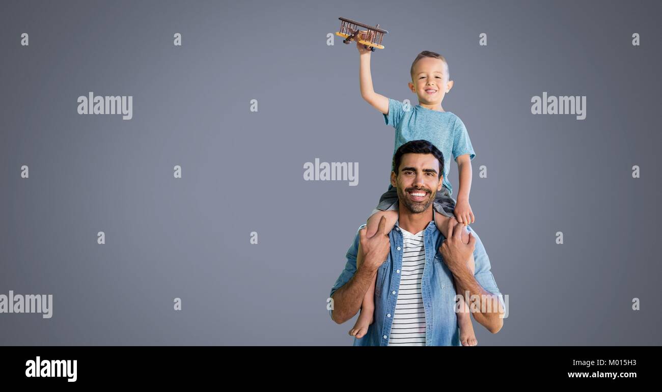 Father and son having fun playing with grey background Stock Photo - Alamy