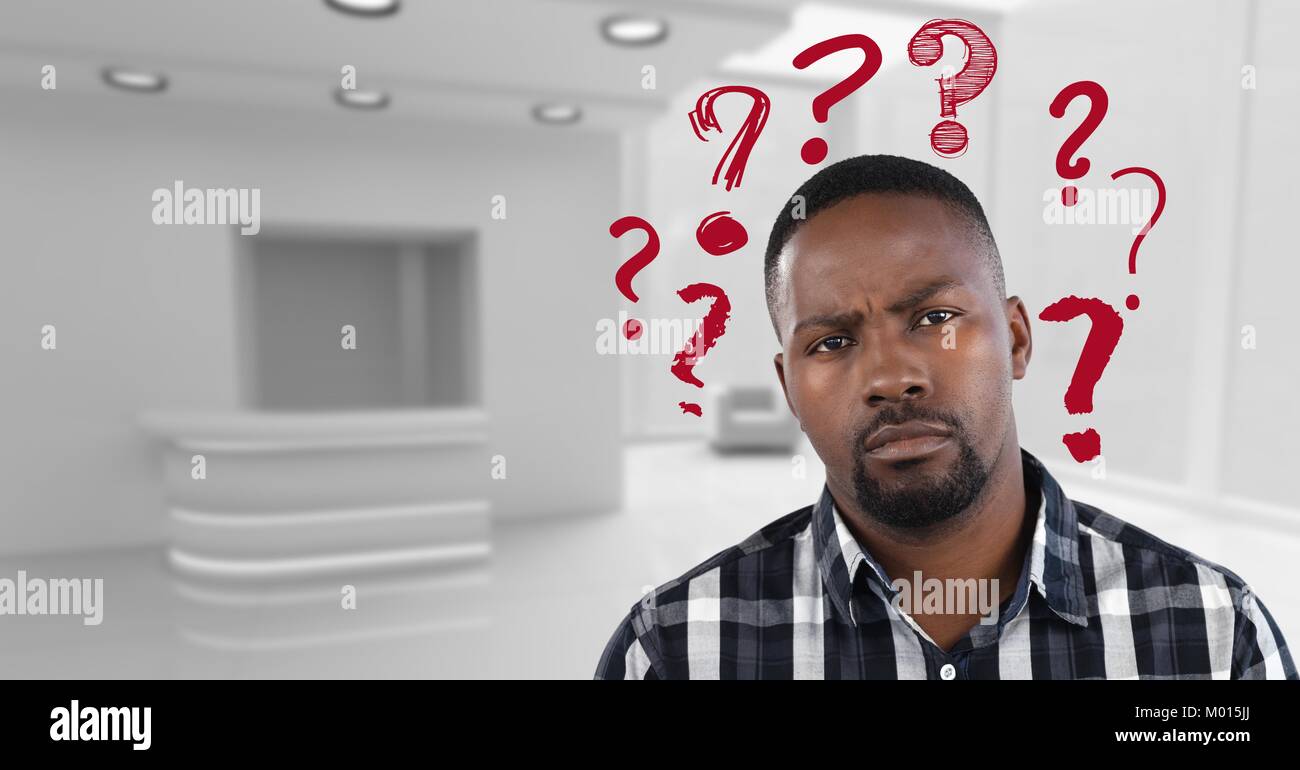 Confused man in a white office with red question marks Stock Photo - Alamy