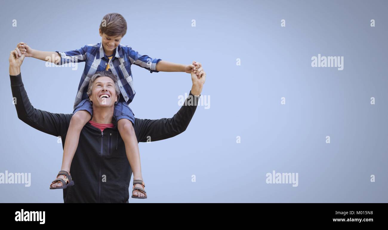 Father and son having fun playing with blue background Stock Photo - Alamy