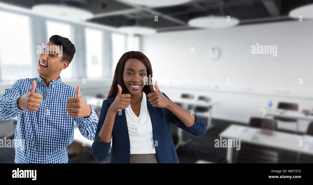 teachers in classroom smiling with thumbs up Stock Photo - Alamy