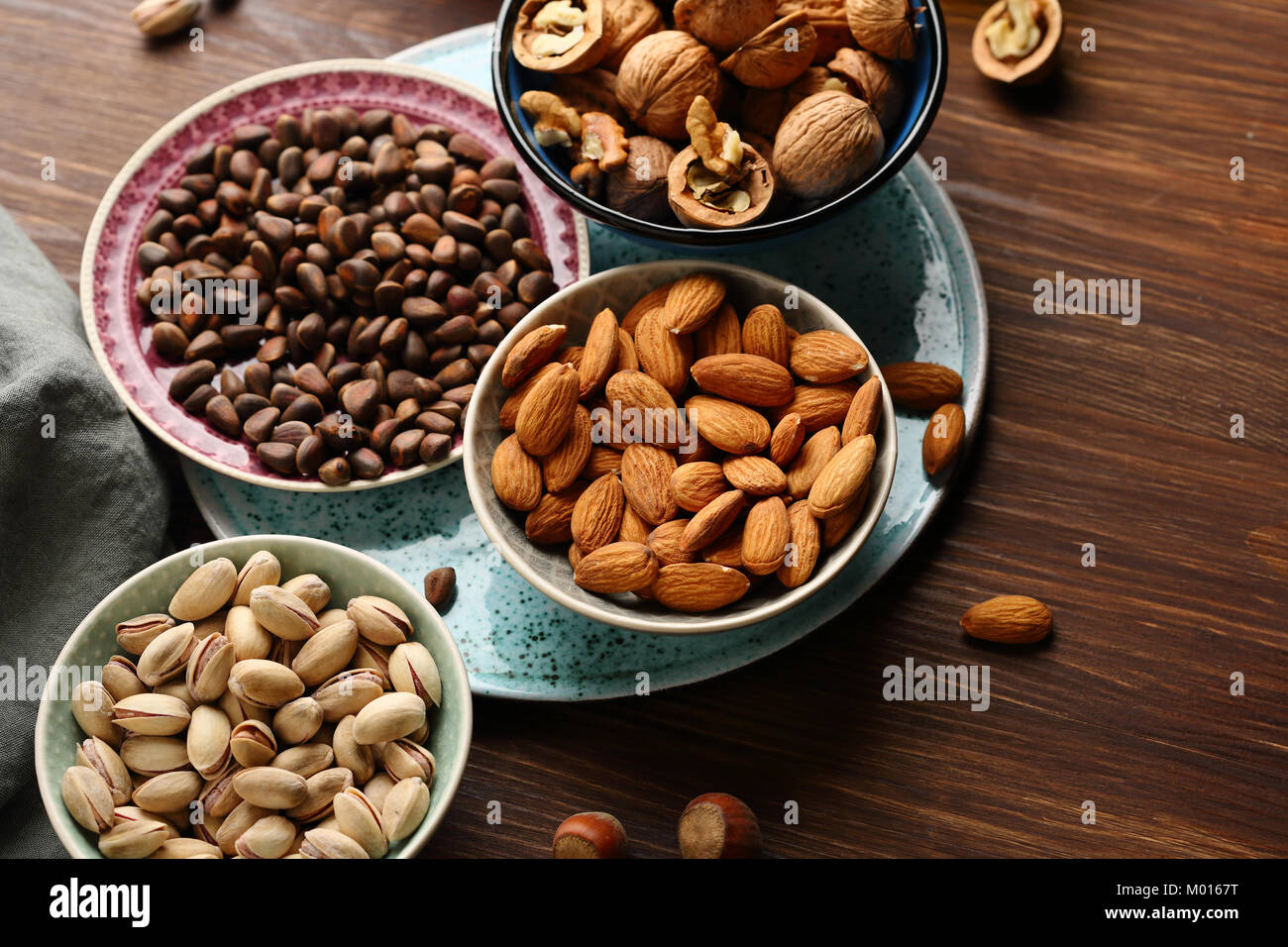 Assorted nut on wooden table, healthy food Stock Photo - Alamy