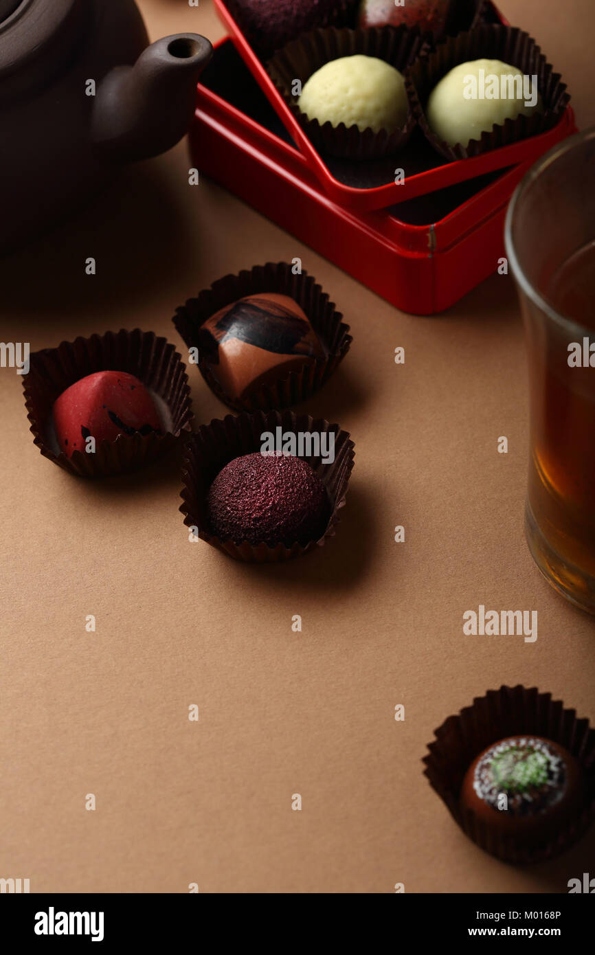 Chocolate candies and tea, food closeup Stock Photo - Alamy
