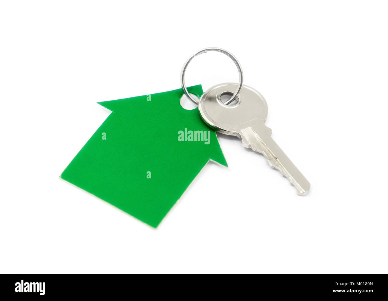 A house made of green cardboard and a key on a white background Stock ...