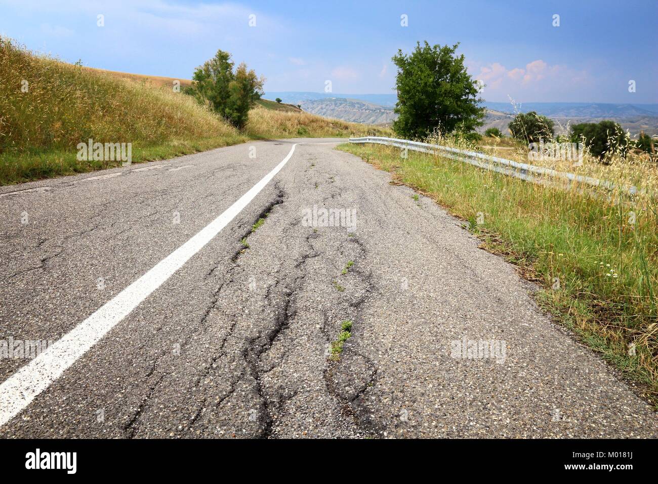 Damaged road - cracked roadway in Basilicata region, Italy Stock Photo ...