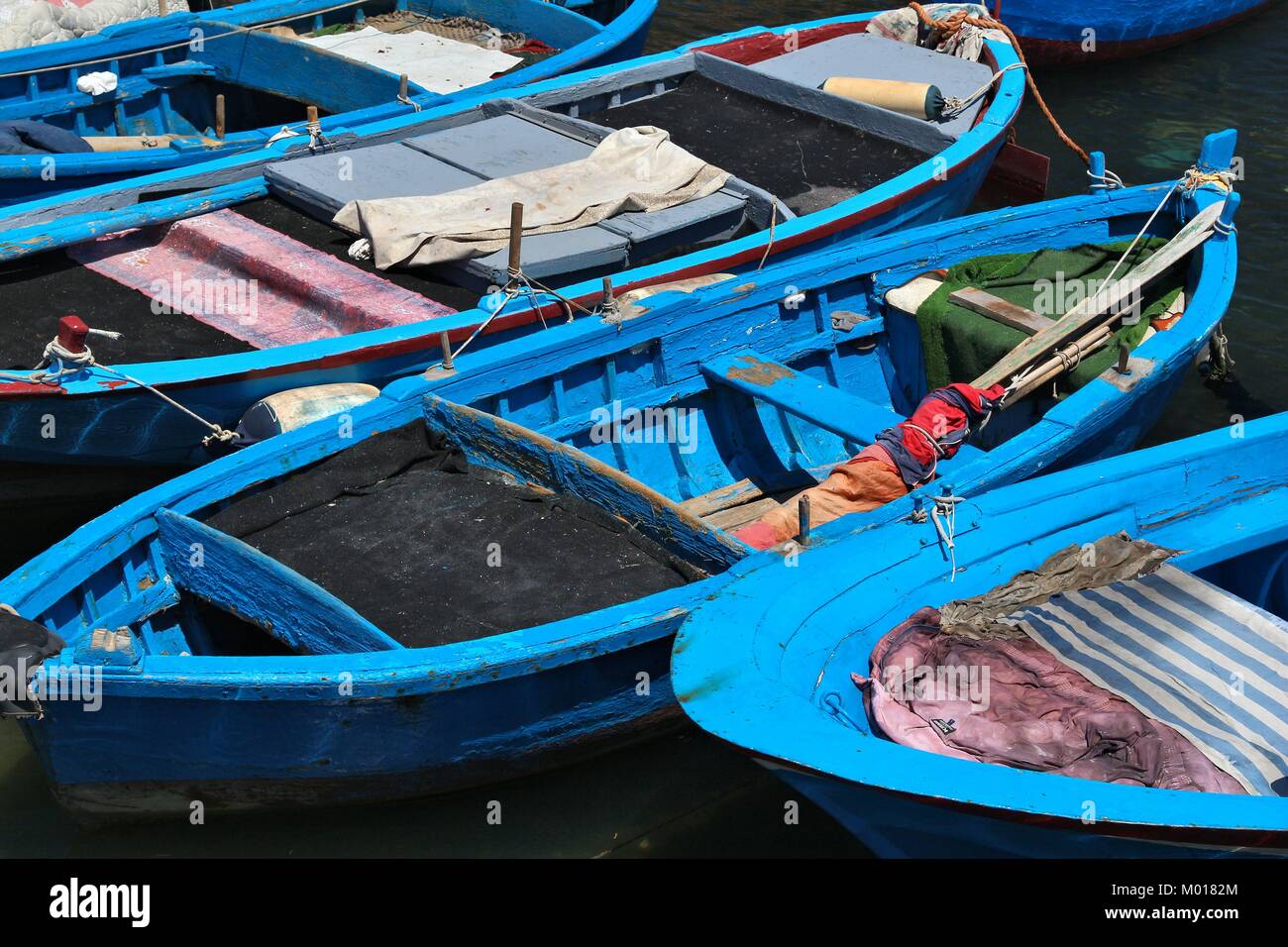 Blue boats in Mediterranean fishing harbor of Bari, Italy Stock Photo ...