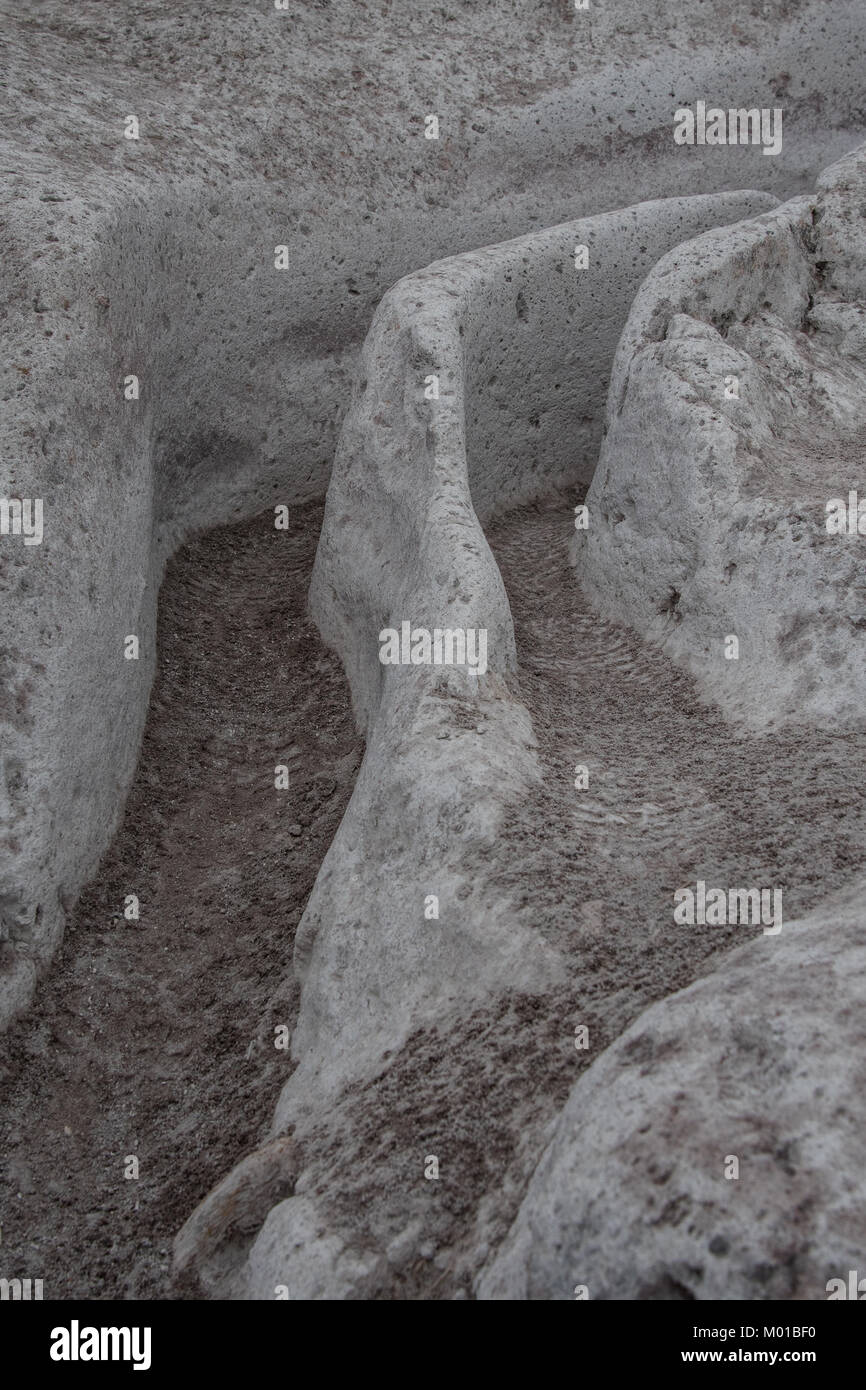 Close Up of Eroded Strips in White Rock along hiking trail in desert ...