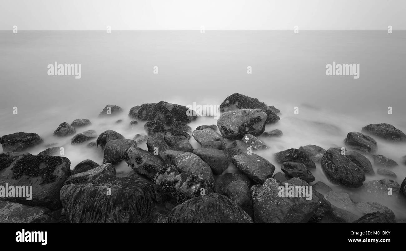 Rocks in blurry water, black and white Stock Photo - Alamy