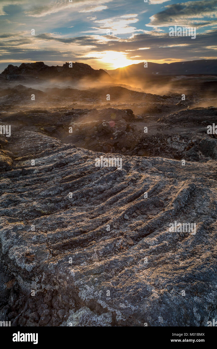 Low sun at a solidified lava landscape at the Geothermal Fields of ...