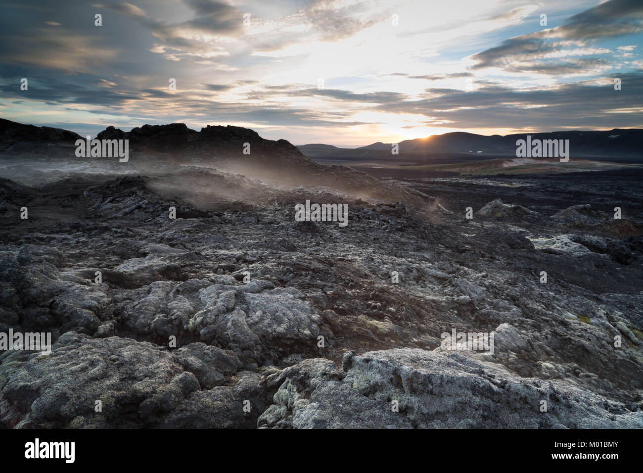 Low sun at a solidified lava landscape at the Geothermal Fields of ...