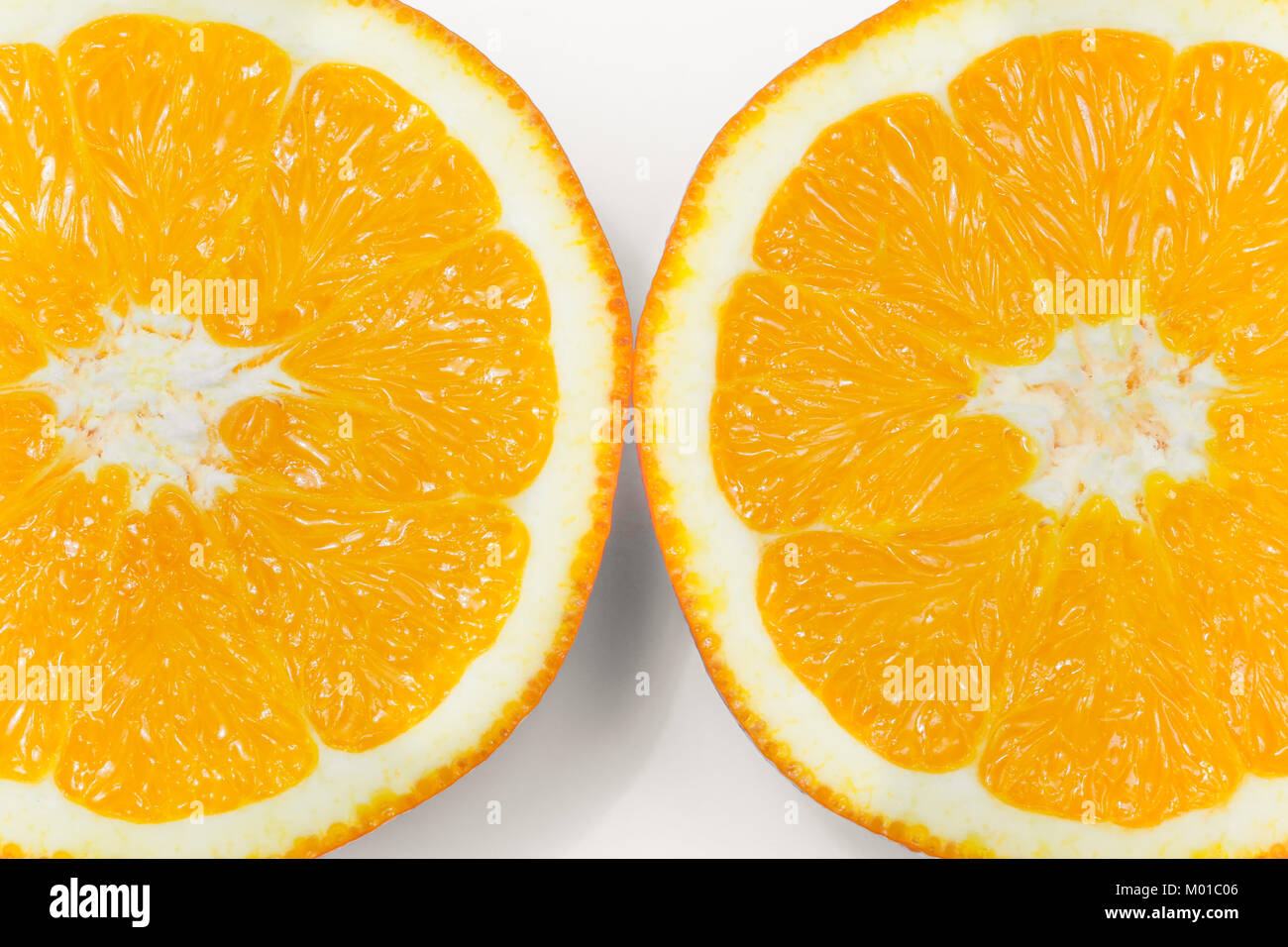 Two halves of an fresh orange on a white background Stock Photo - Alamy