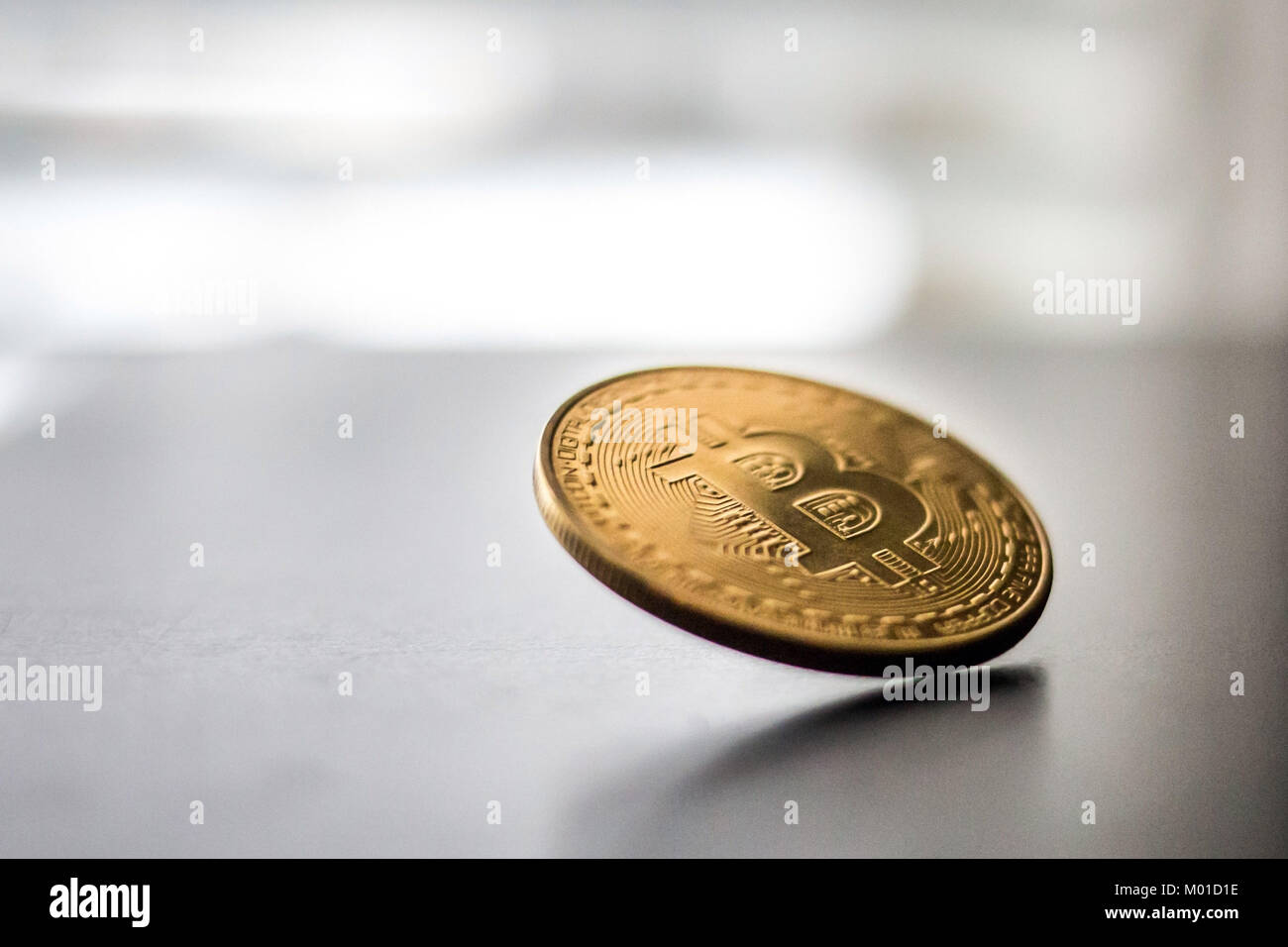 Single bitcoin front coin spinning falling down Stock Photo - Alamy