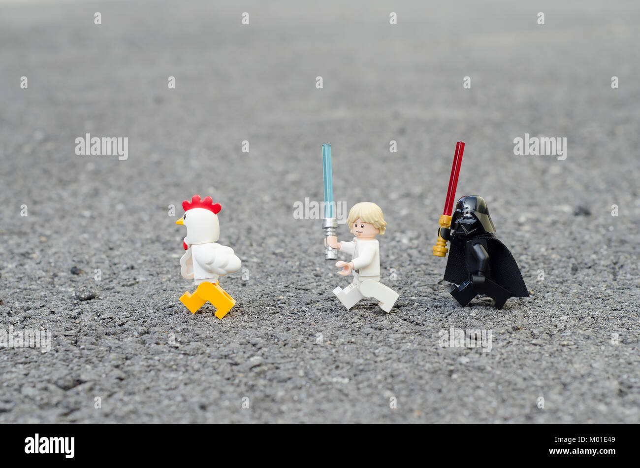 lego darth vader and luke skywalker chasing chicken suit guy Stock ...