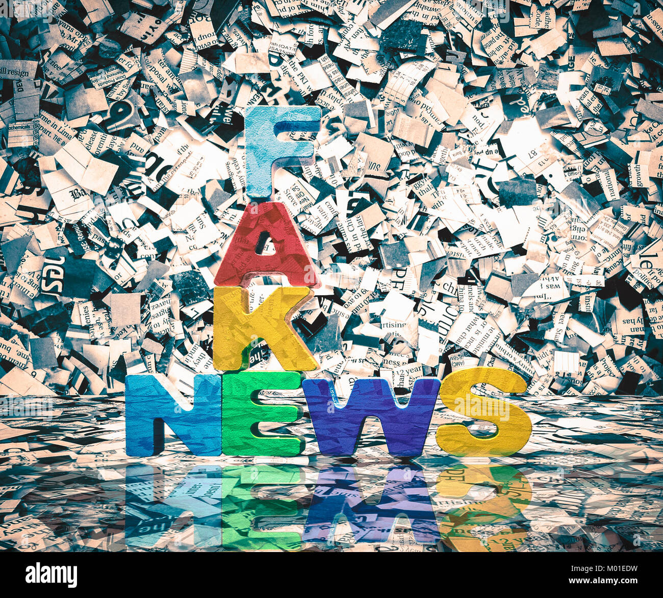 newspaper confetti and wooden letters ake nes Stock Photo - Alamy