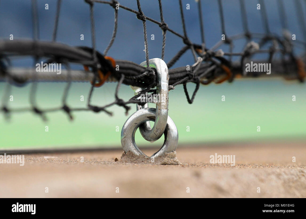Bolt ring connection holding down foul netting at a minor league ...