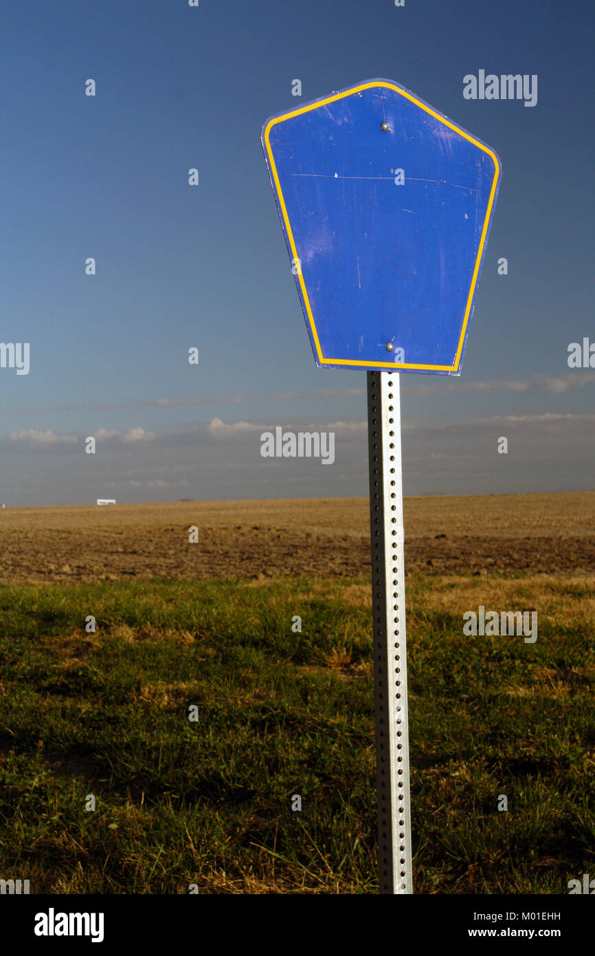 Blank county road sign with pastureland and clouds in background Stock ...