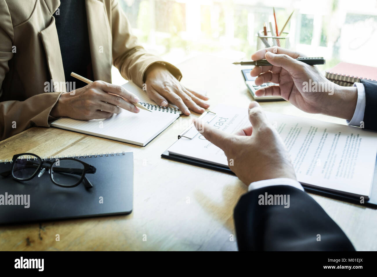 Young business team working with new startup project offering contract ...